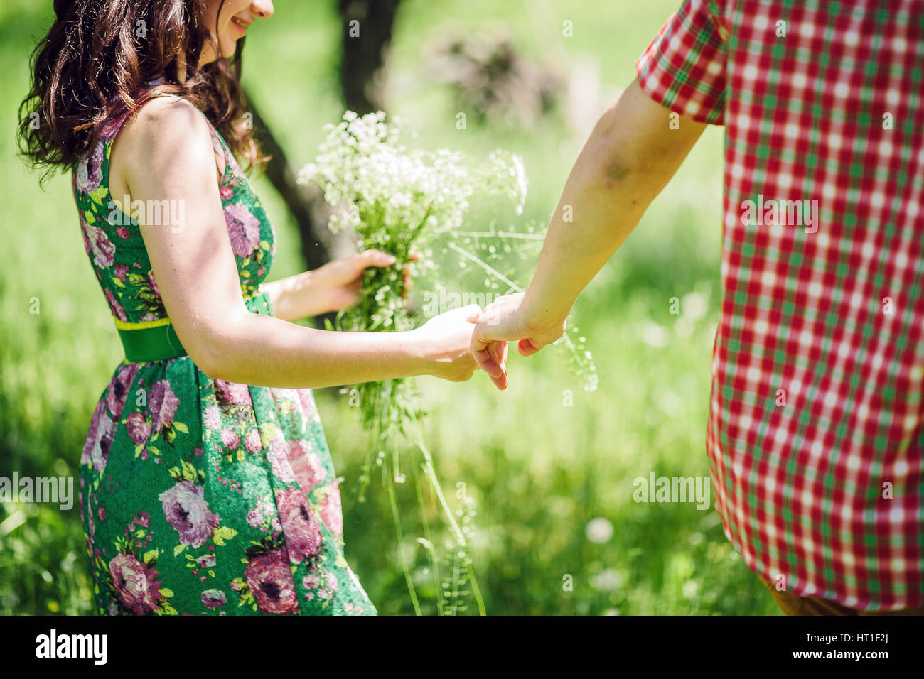 lovely couple holding hands together. Close up shot Stock Photo - Alamy