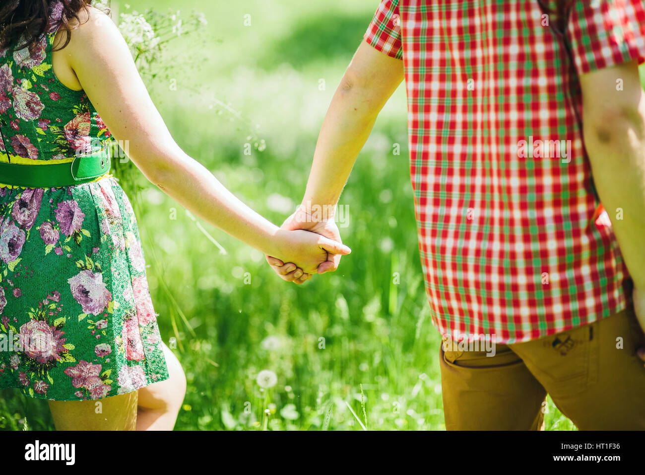 lovely couple holding hands together. Close up shot Stock Photo - Alamy