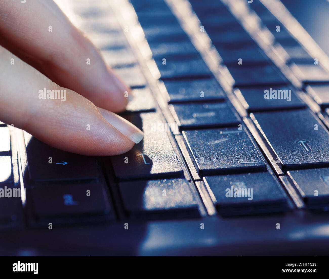female fingers on the laptop keyboard close up Stock Photo - Alamy