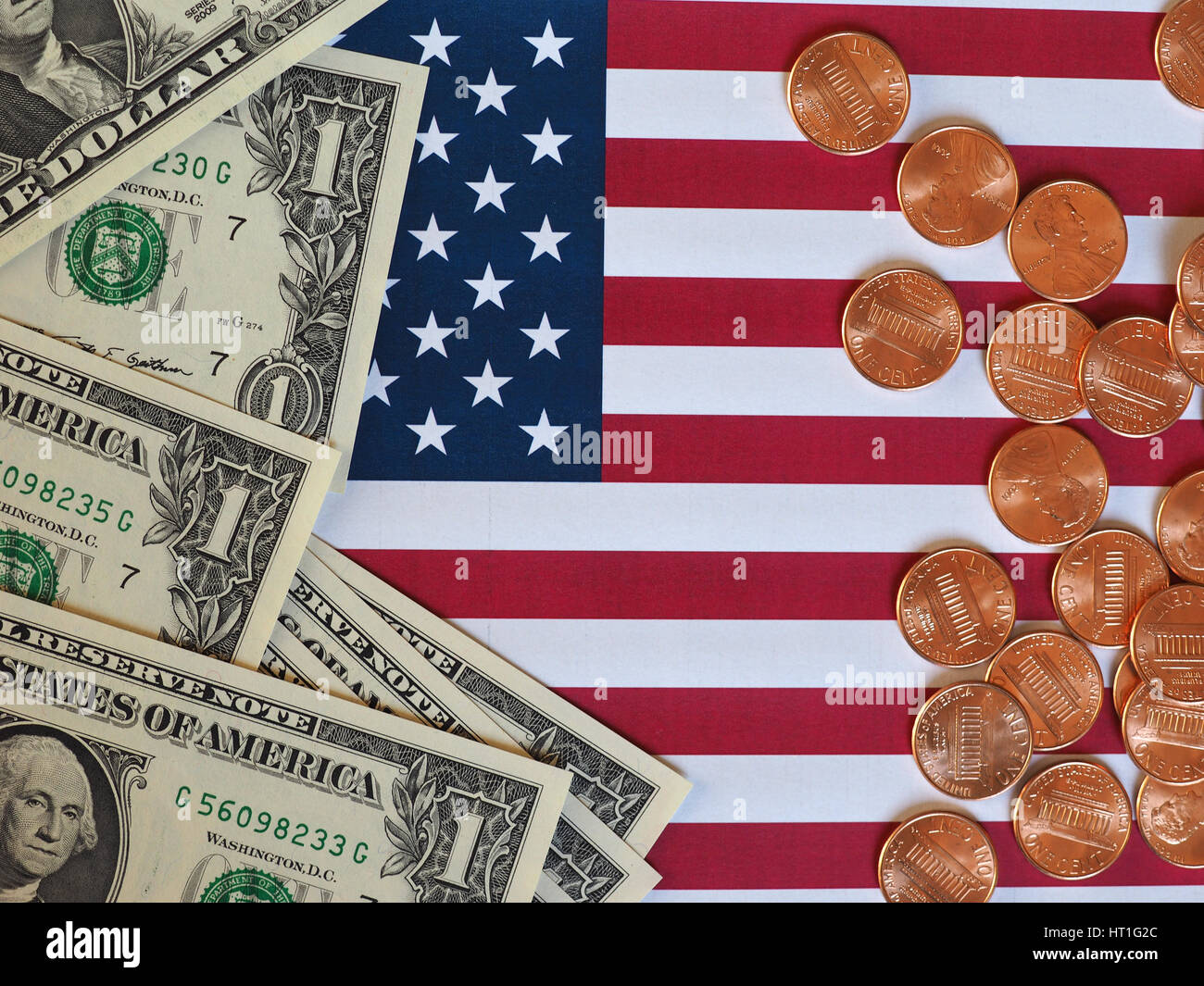 One Dollar banknotes and One Cent coins (USD) currency money over the ...