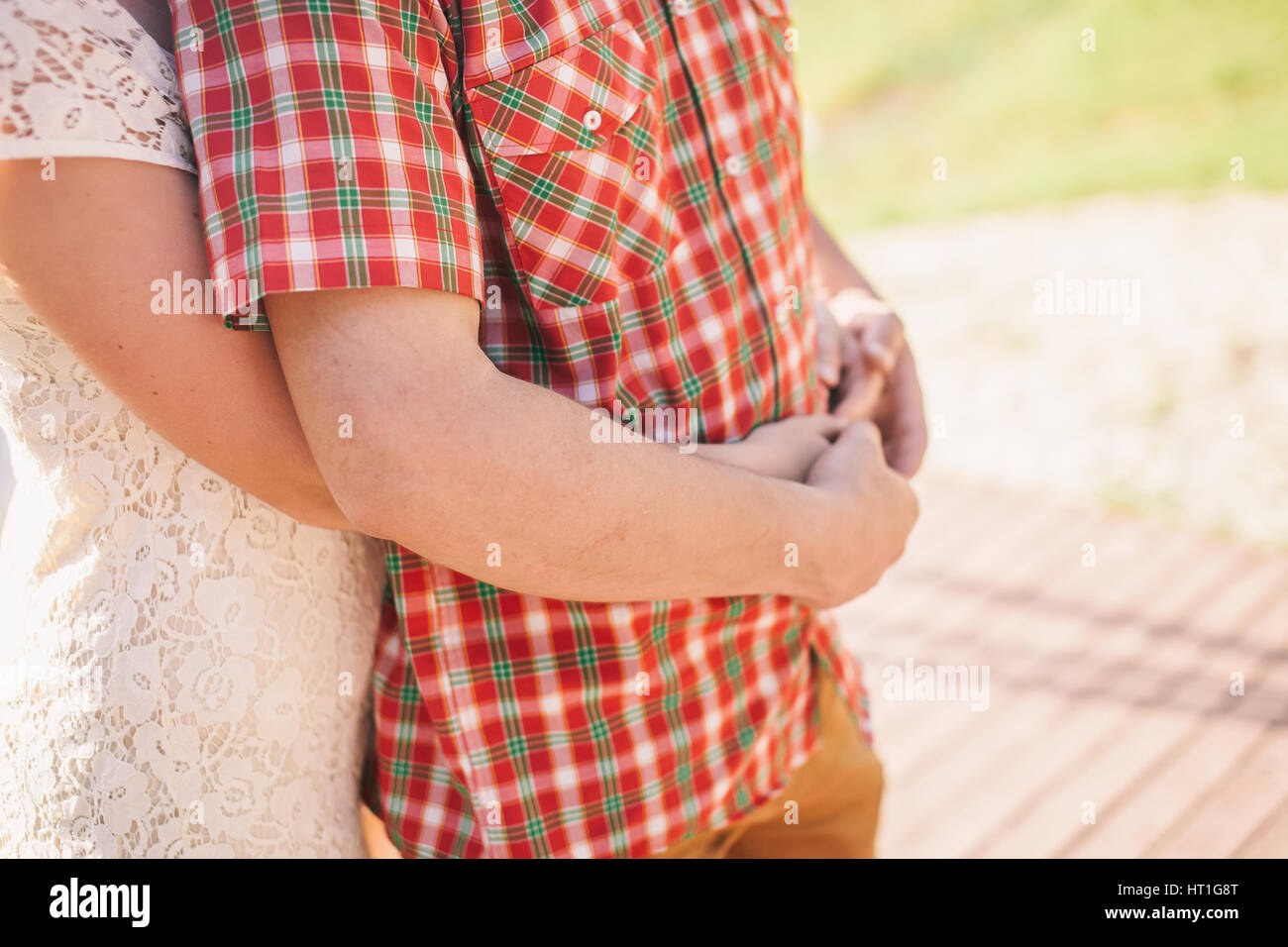 engaged couple hug together. Close up shot of hands Stock Photo - Alamy