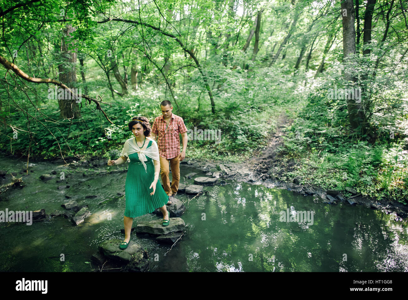 vintage love story couple. Retro style engaged couple at country side ...