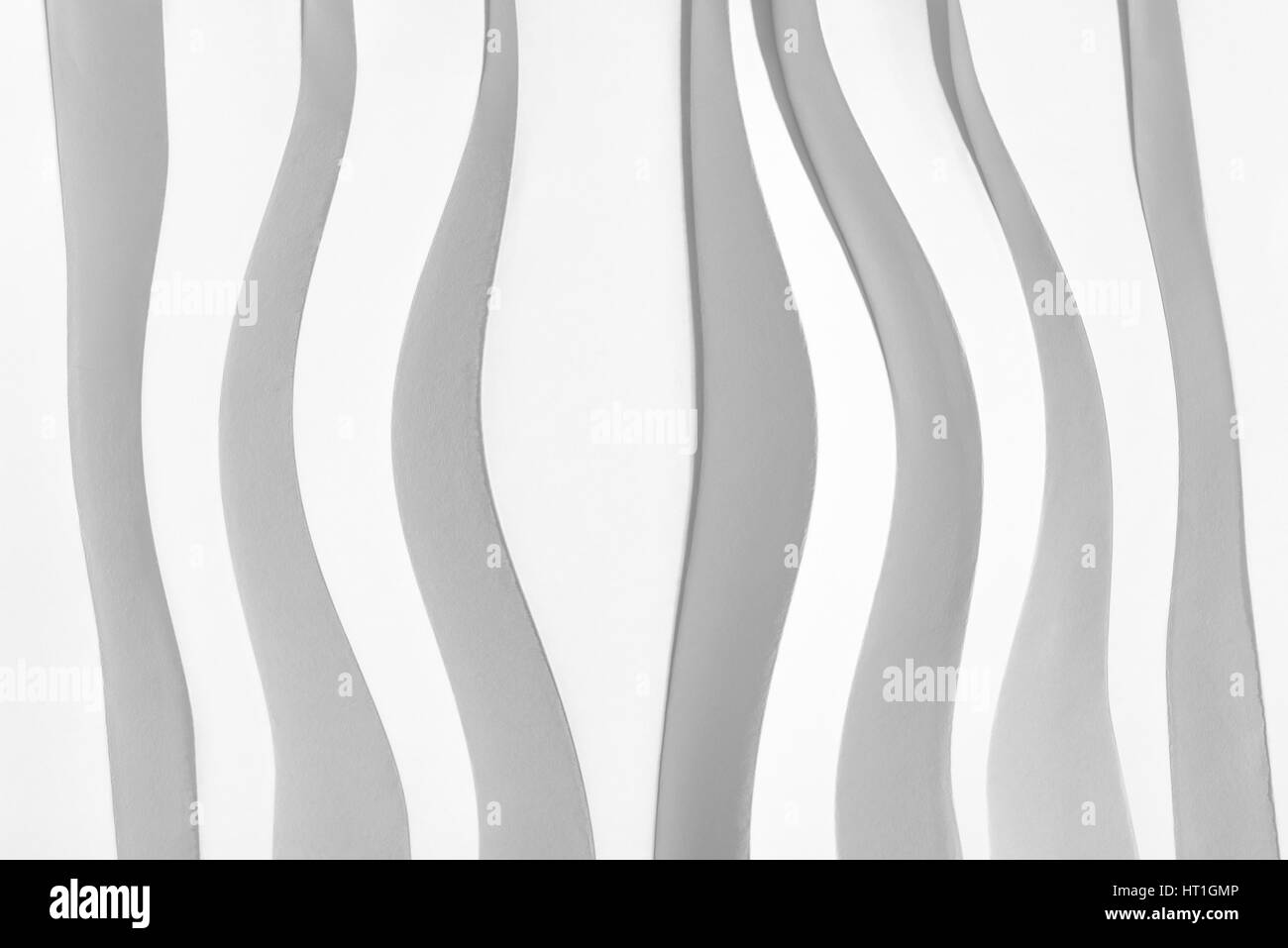 White folded sheet of paper showing an abstract texture design under ...