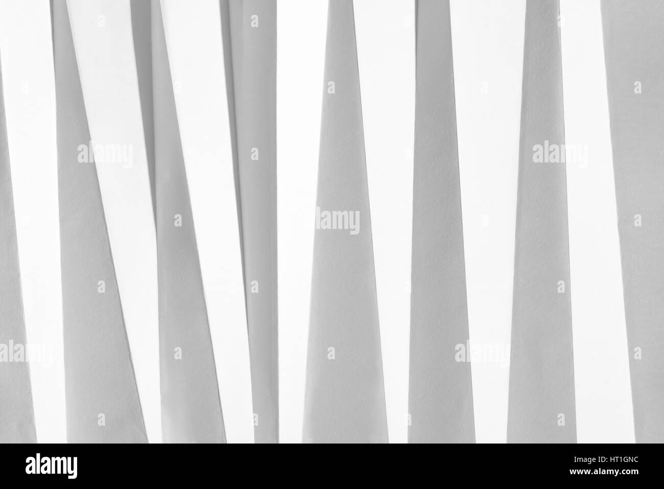 White folded sheet of paper showing an abstract texture design under ...