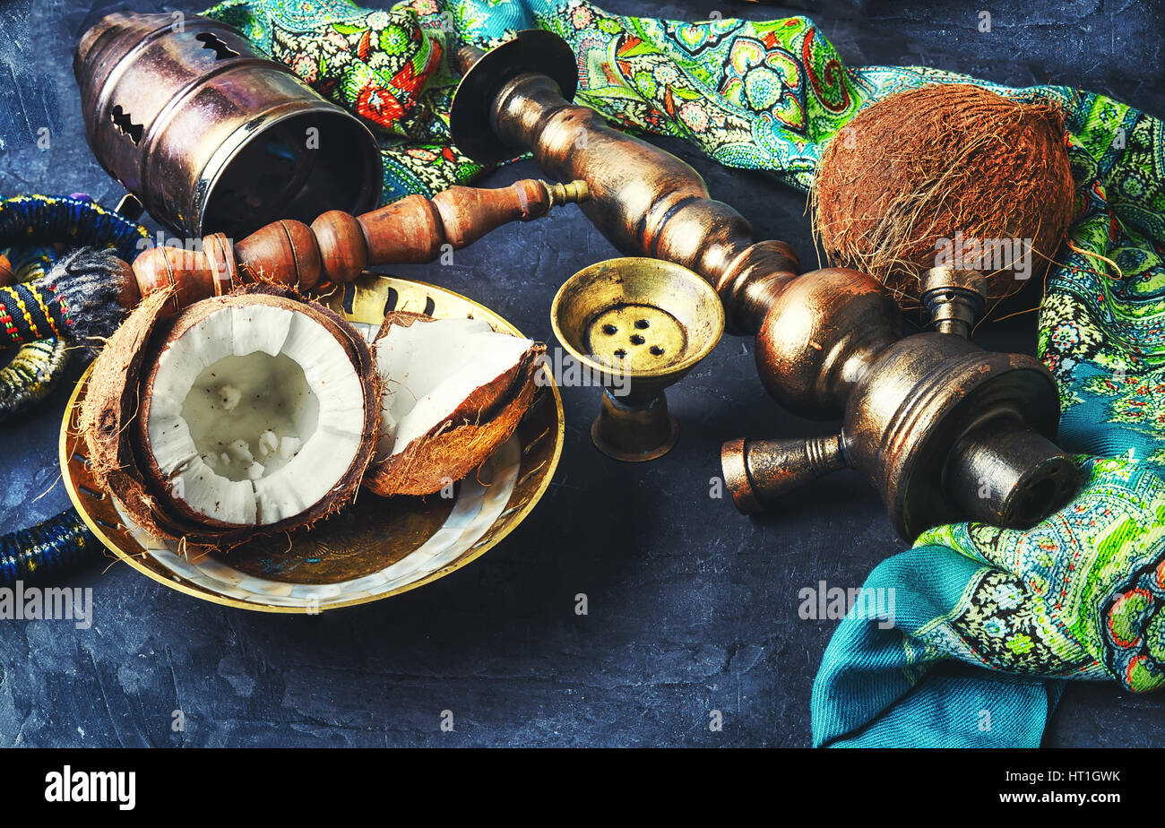 smoke oriental shisha and ripe tropical coconut Stock Photo - Alamy