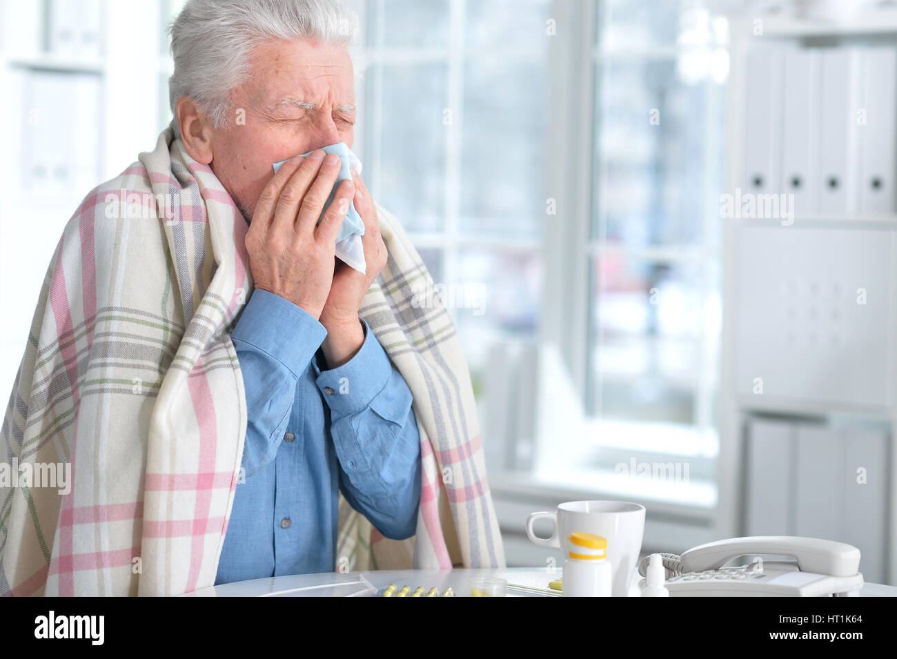 Portrait of a sick elderly man with pills Stock Photo - Alamy