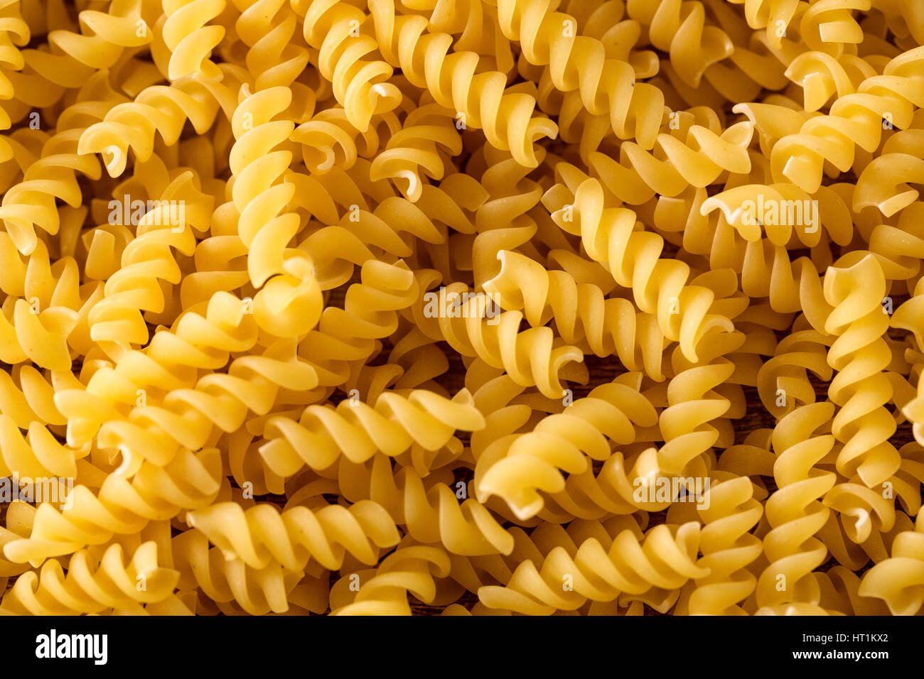 yellow fresh macaroni Italian pasta background Stock Photo - Alamy