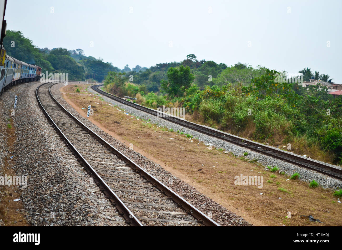 Railway tracks passing through a rural area Stock Photo - Alamy