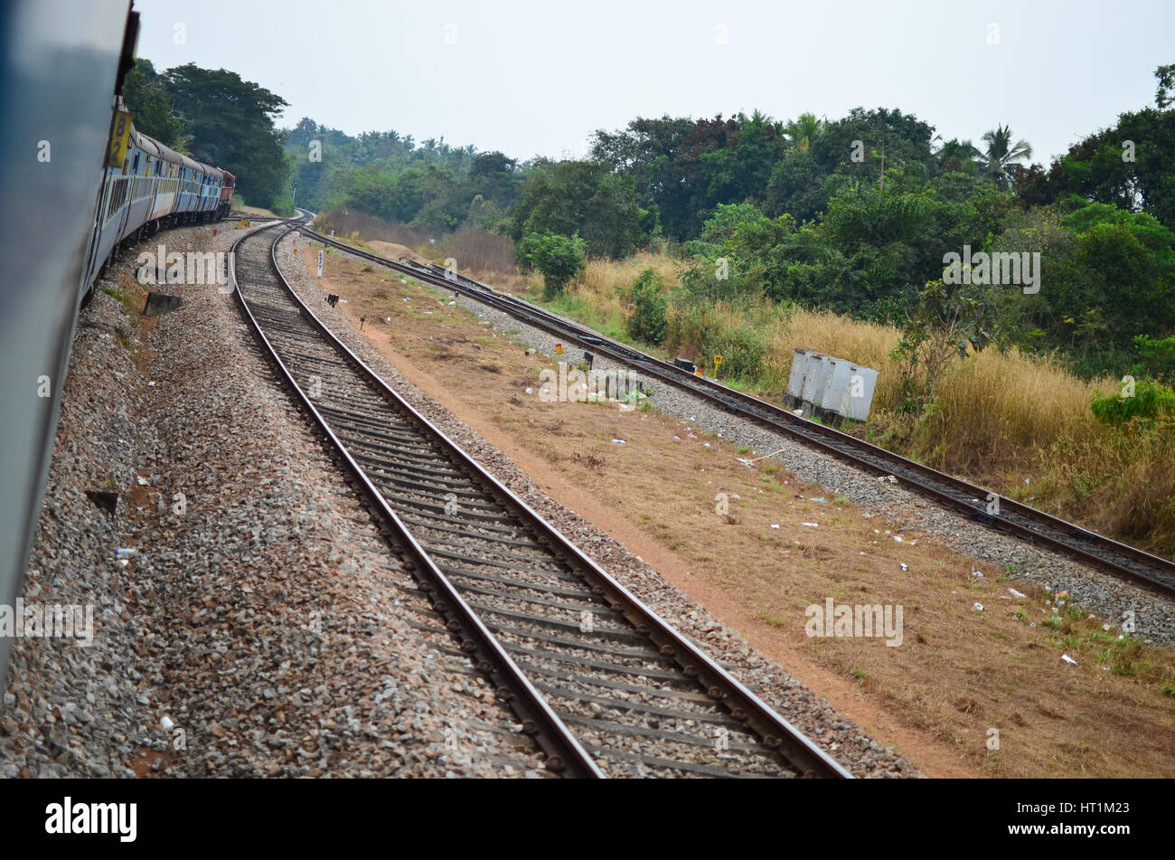 Railway tracks passing through a rural area Stock Photo - Alamy