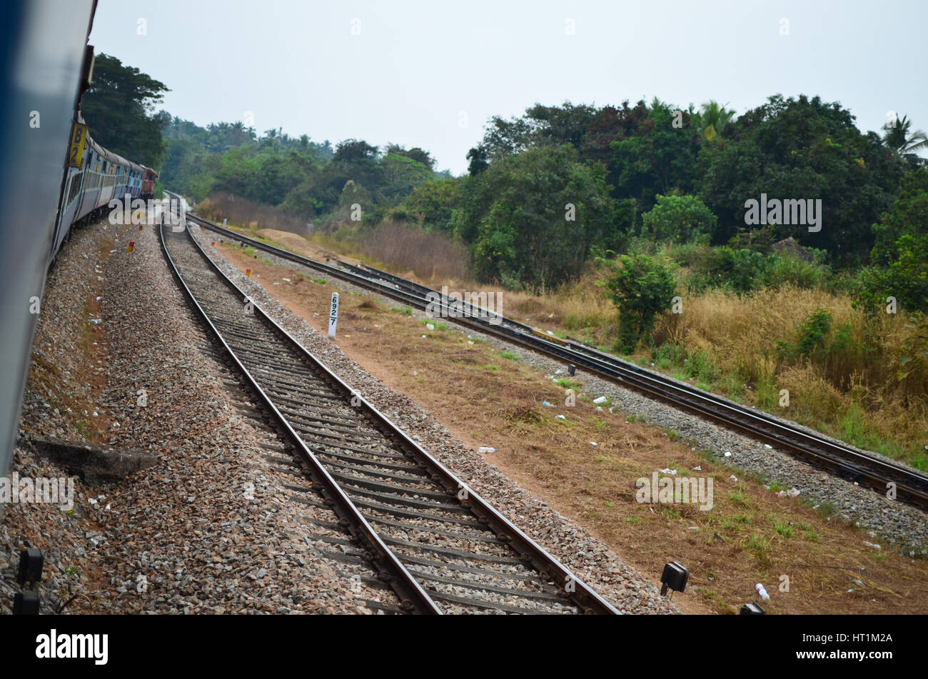 Railway tracks passing through a rural area Stock Photo - Alamy
