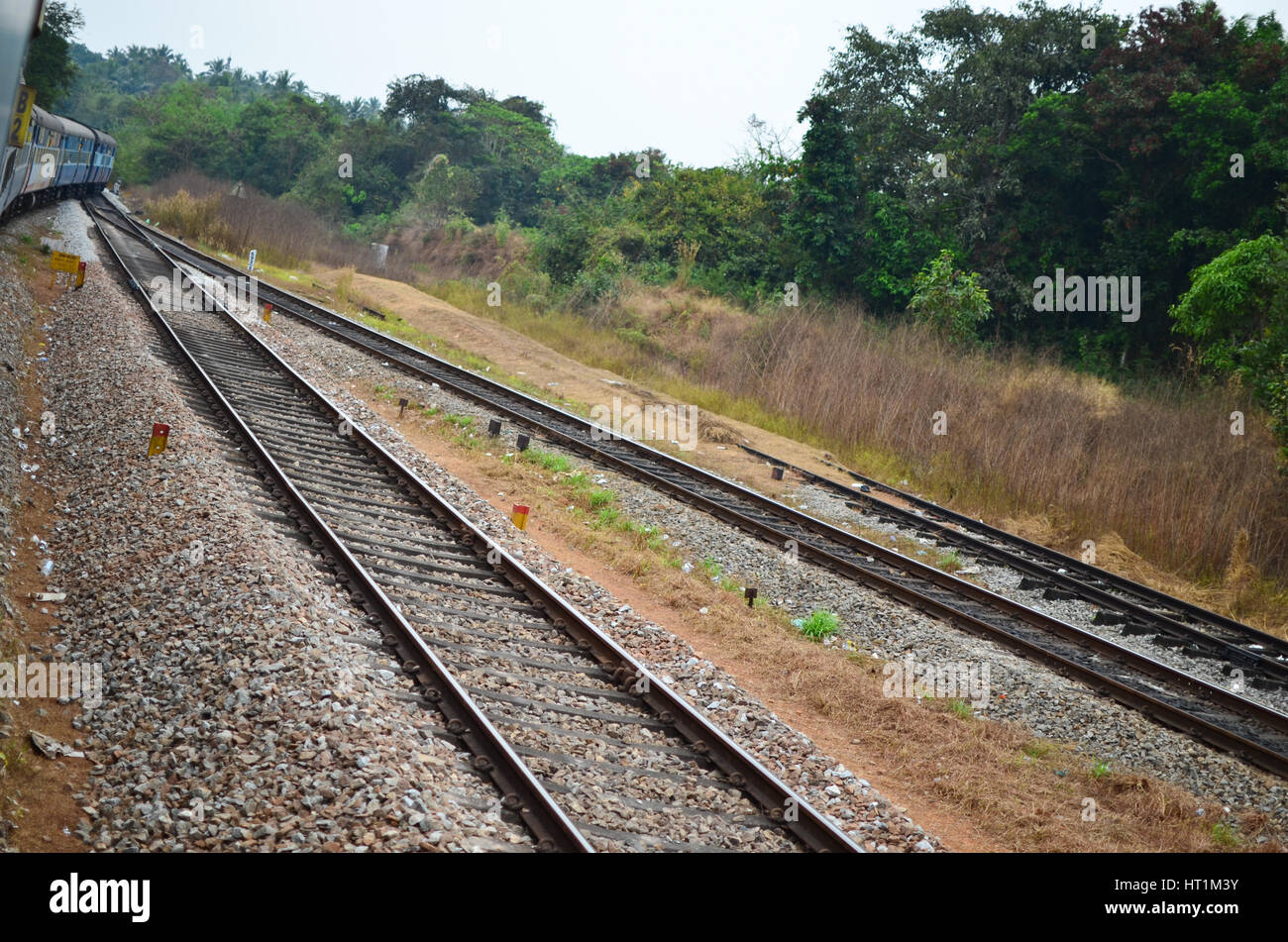 Railway tracks passing through a rural area Stock Photo - Alamy