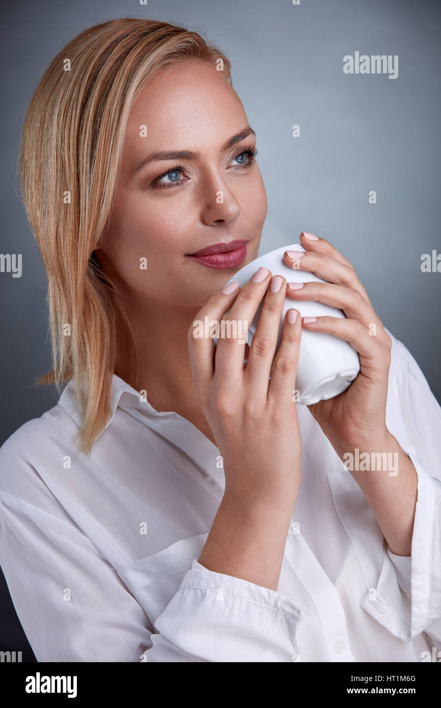 Good looking woman with cup of coffee Stock Photo - Alamy