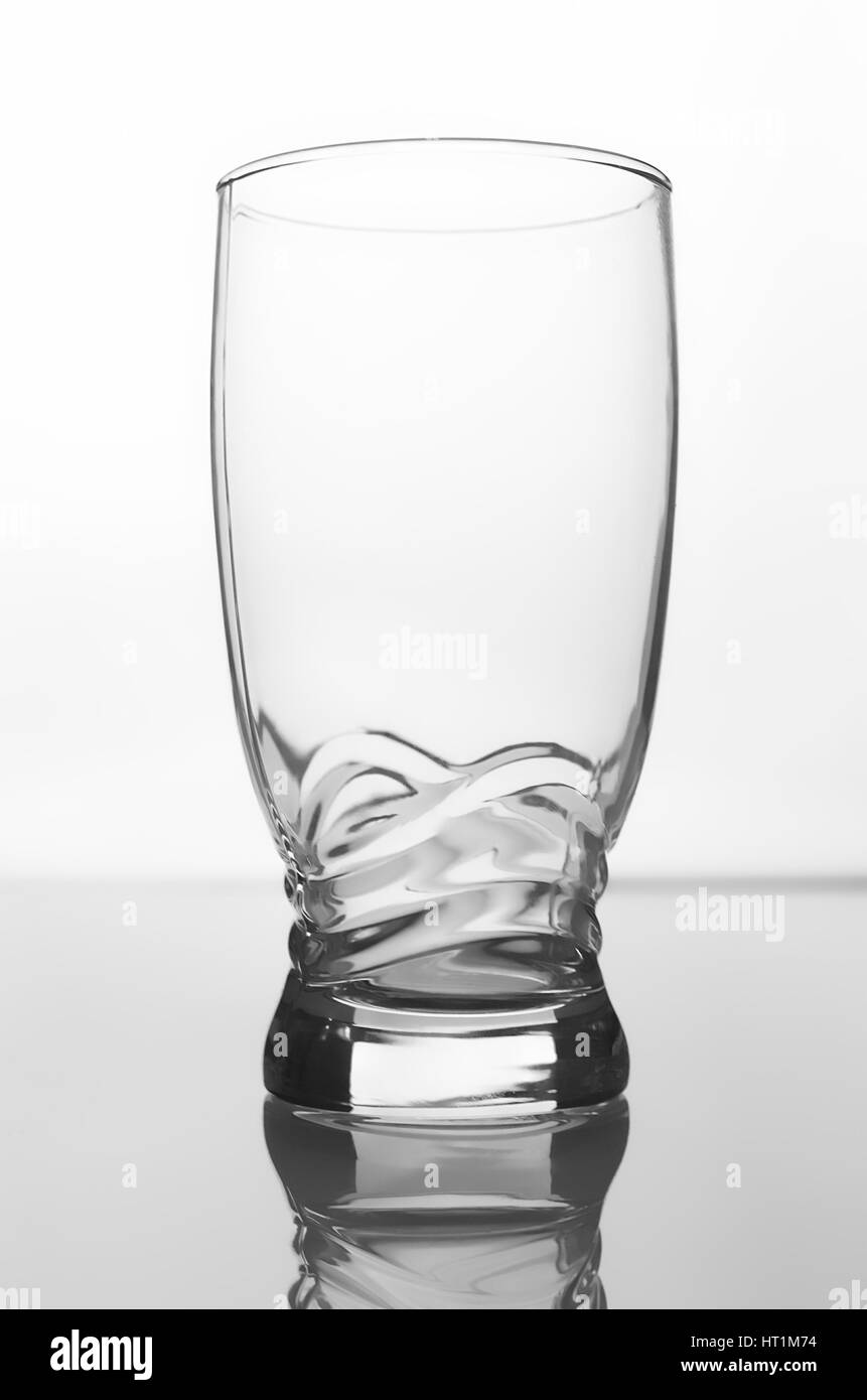 Elegant empty glass isolated on white background Stock Photo - Alamy