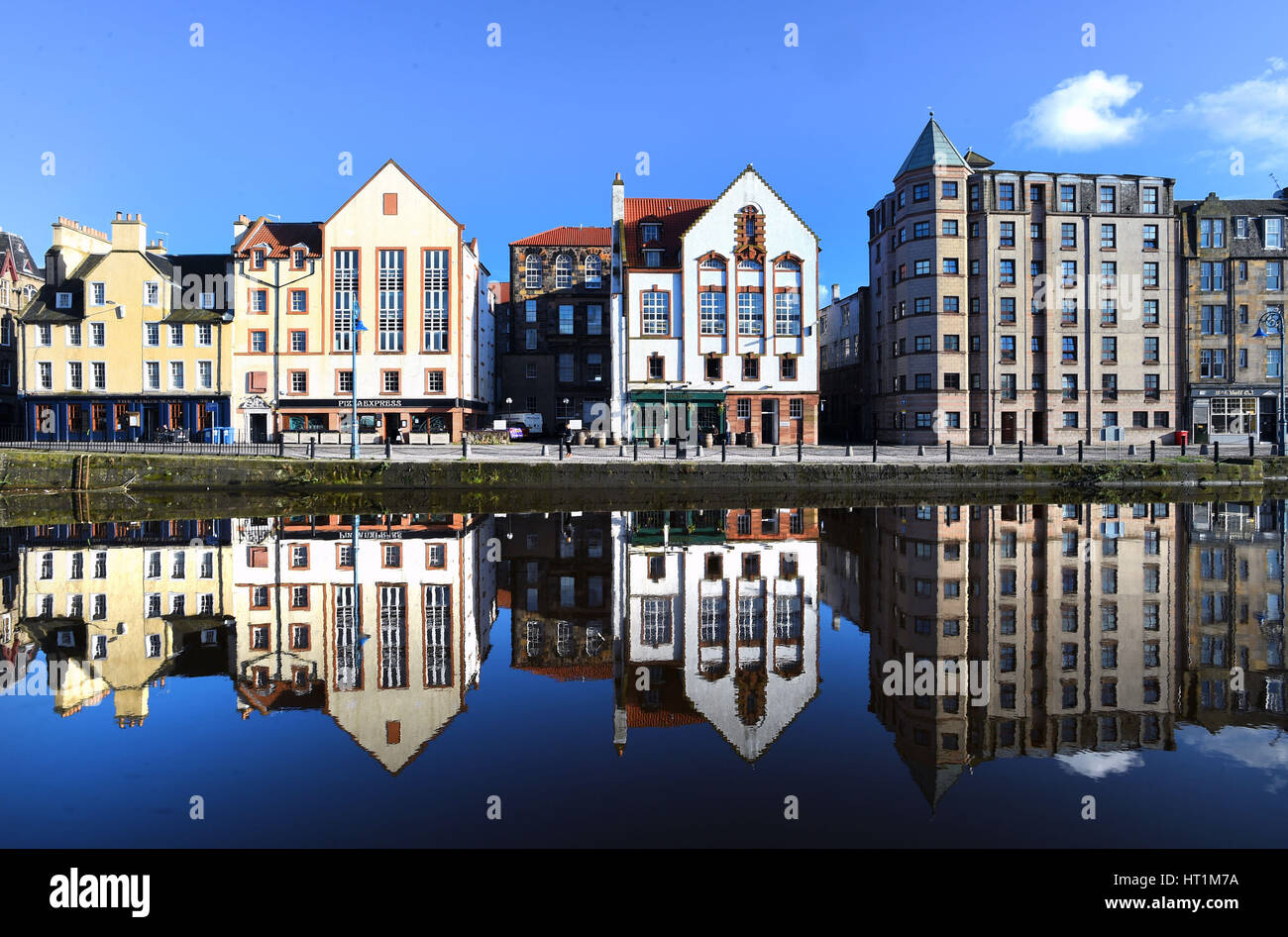 Edinburgh are reflected in the unusually still water of leith hi-res ...
