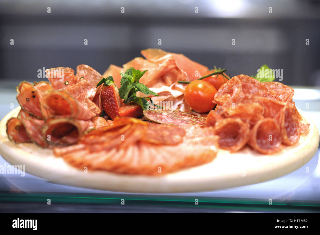 Food tray with delicious salami, pieces of sliced ham, sausage Stock ...