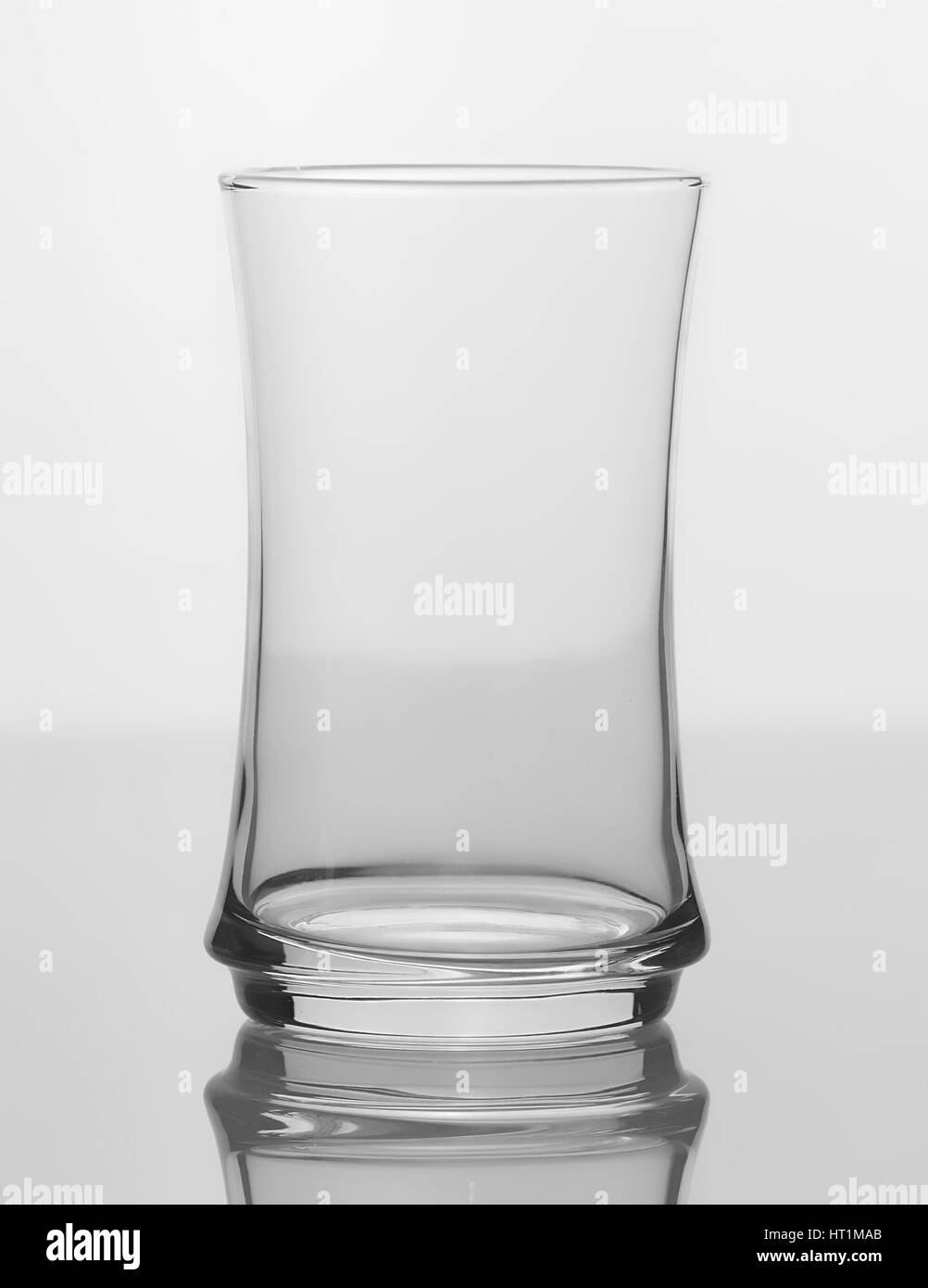 Elegant empty glass isolated on white background Stock Photo - Alamy