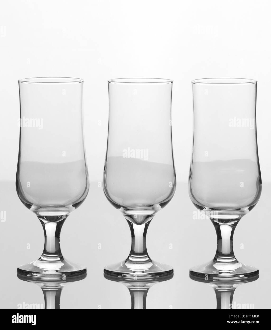 Elegant three empty glasses isolated on white background Stock Photo ...