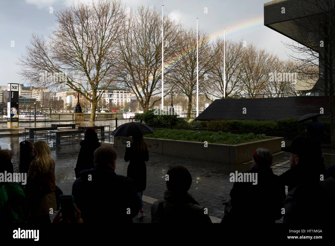 London Rainbow over the River Thames & Southbank. People looking at a ...