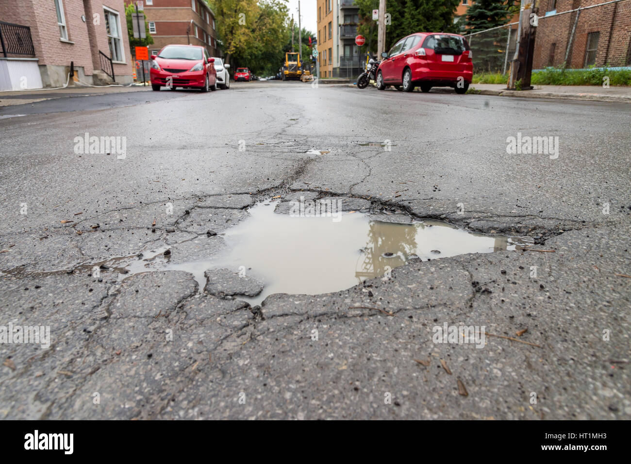 Large deep pothole in Montreal street, Canada Stock Photo - Alamy