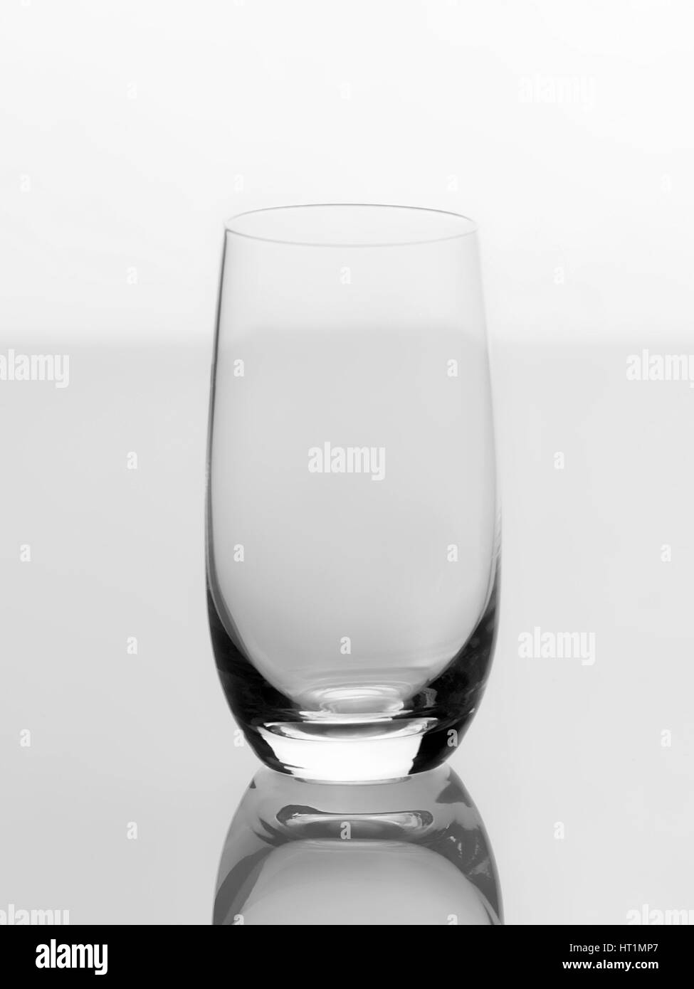 Empty glass isolated on a white background Stock Photo - Alamy