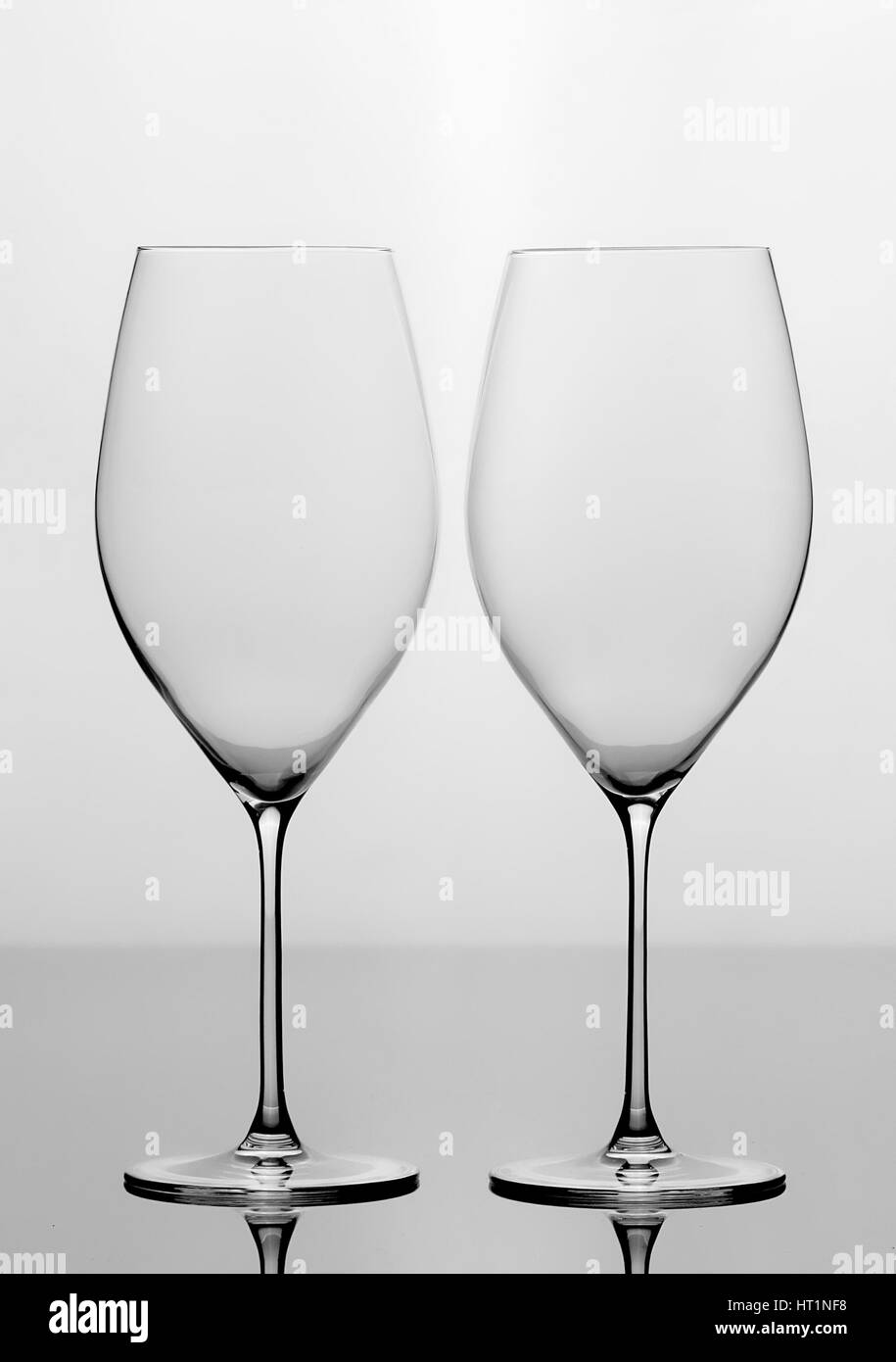 Two empty wine glasses, isolated on white background Stock Photo - Alamy