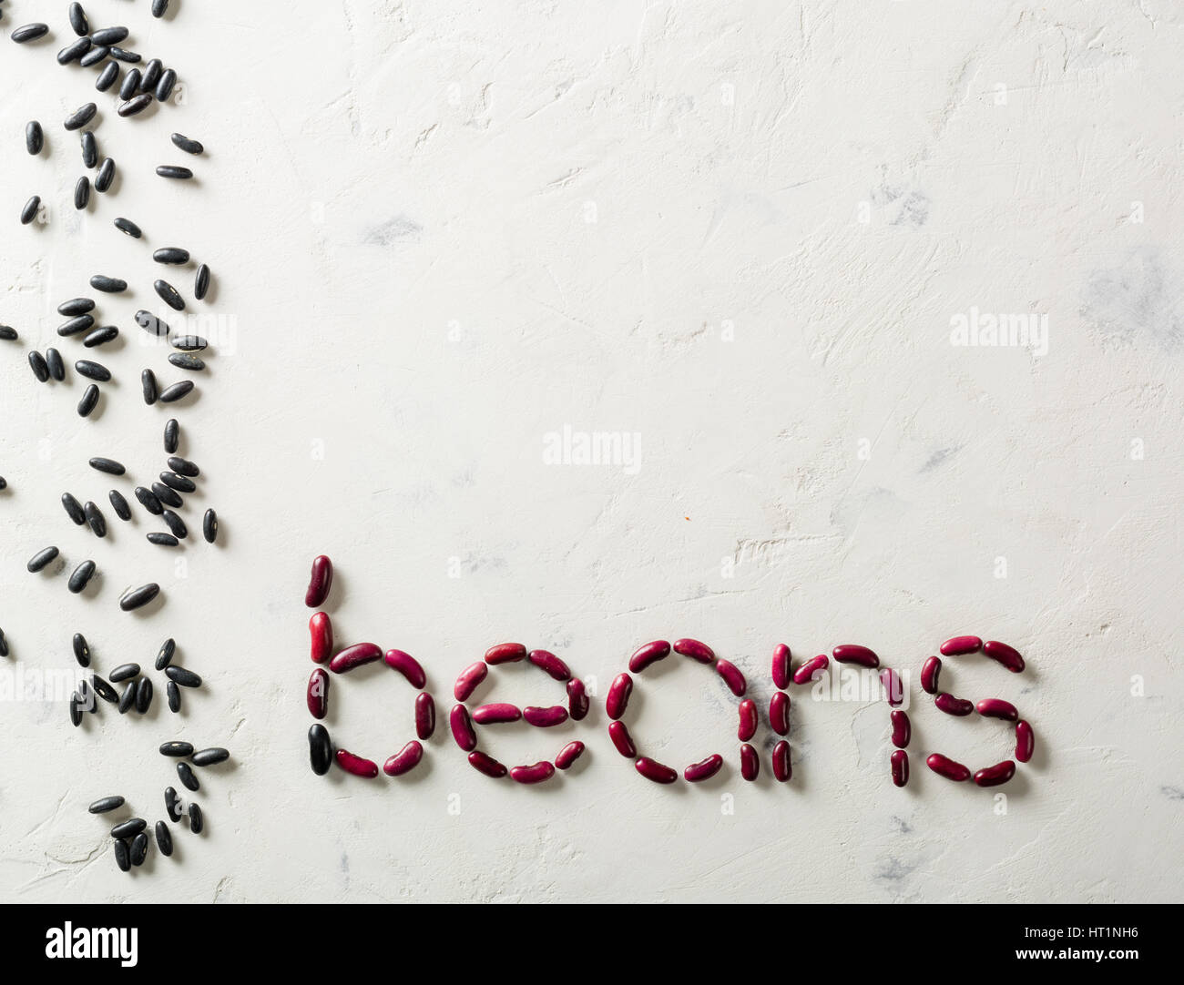 Word made up of beans red beans. White stone background. A lot of empty ...