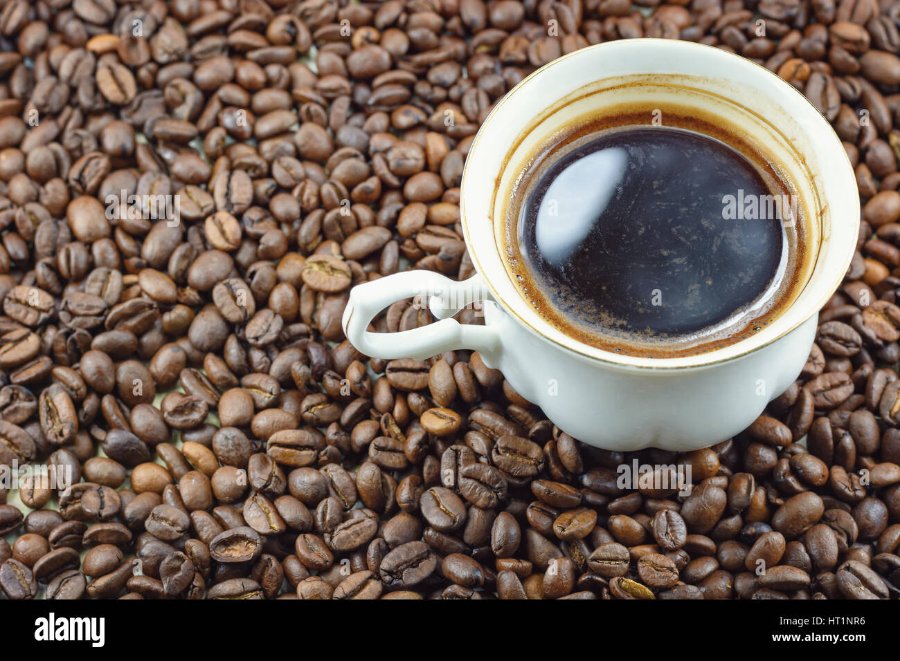 Сup of coffee on the background of coffee beans Stock Photo - Alamy