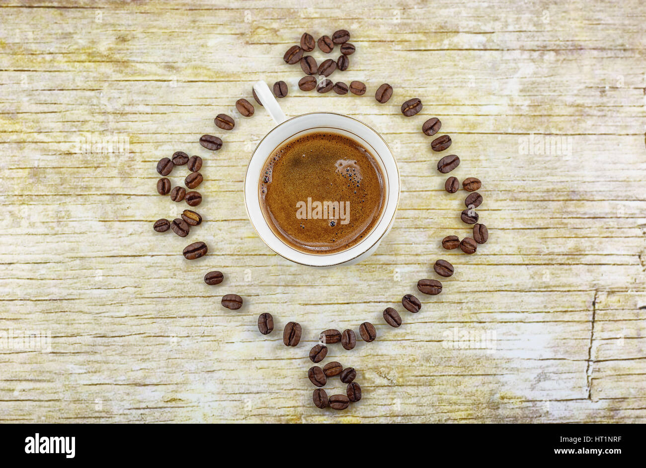 From coffee beans lined clock indicating a pause Stock Photo - Alamy