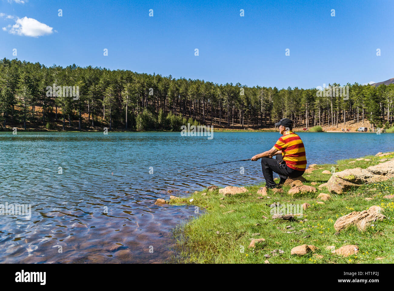 Man catching fish hi-res stock photography and images - Alamy