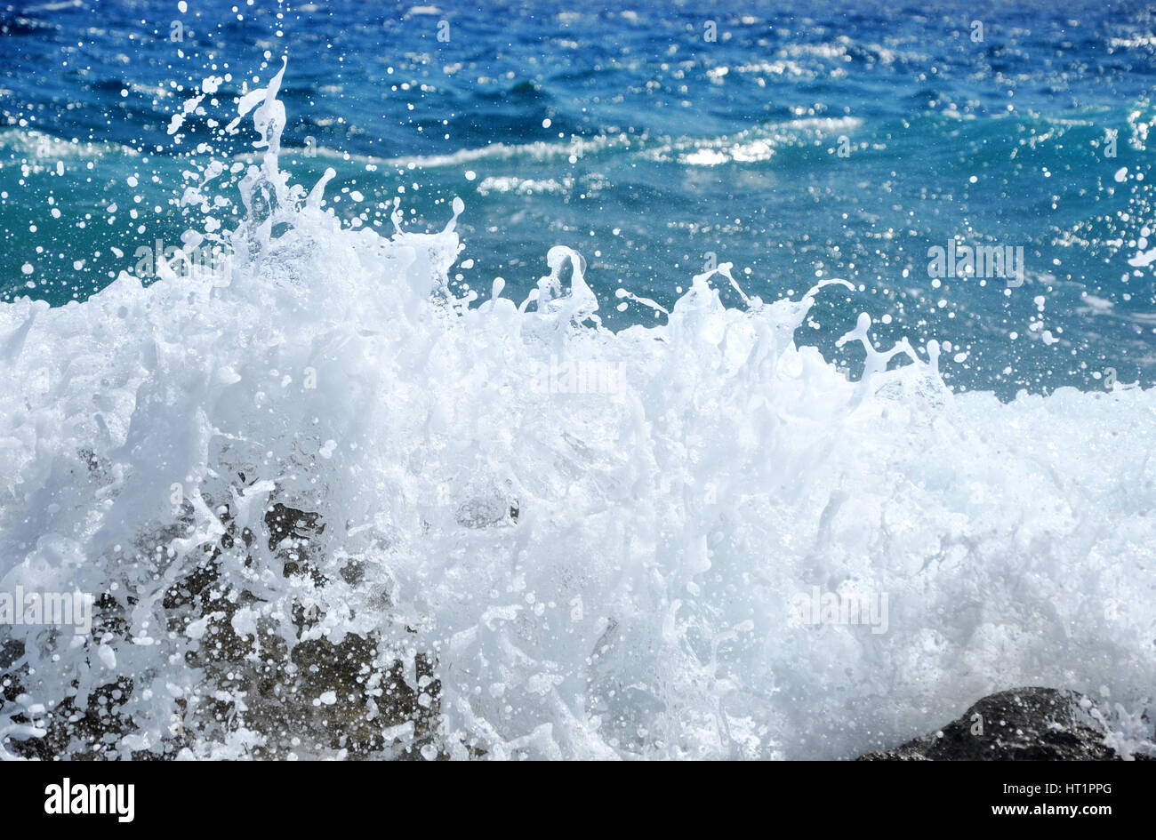 Splashing sea wave Stock Photo - Alamy