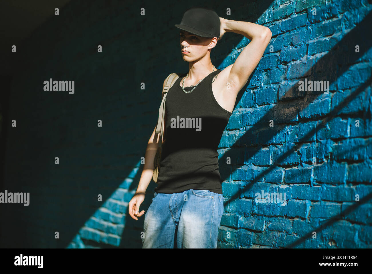hip hop teenage man. Teenager relax on street in cap Stock Photo - Alamy