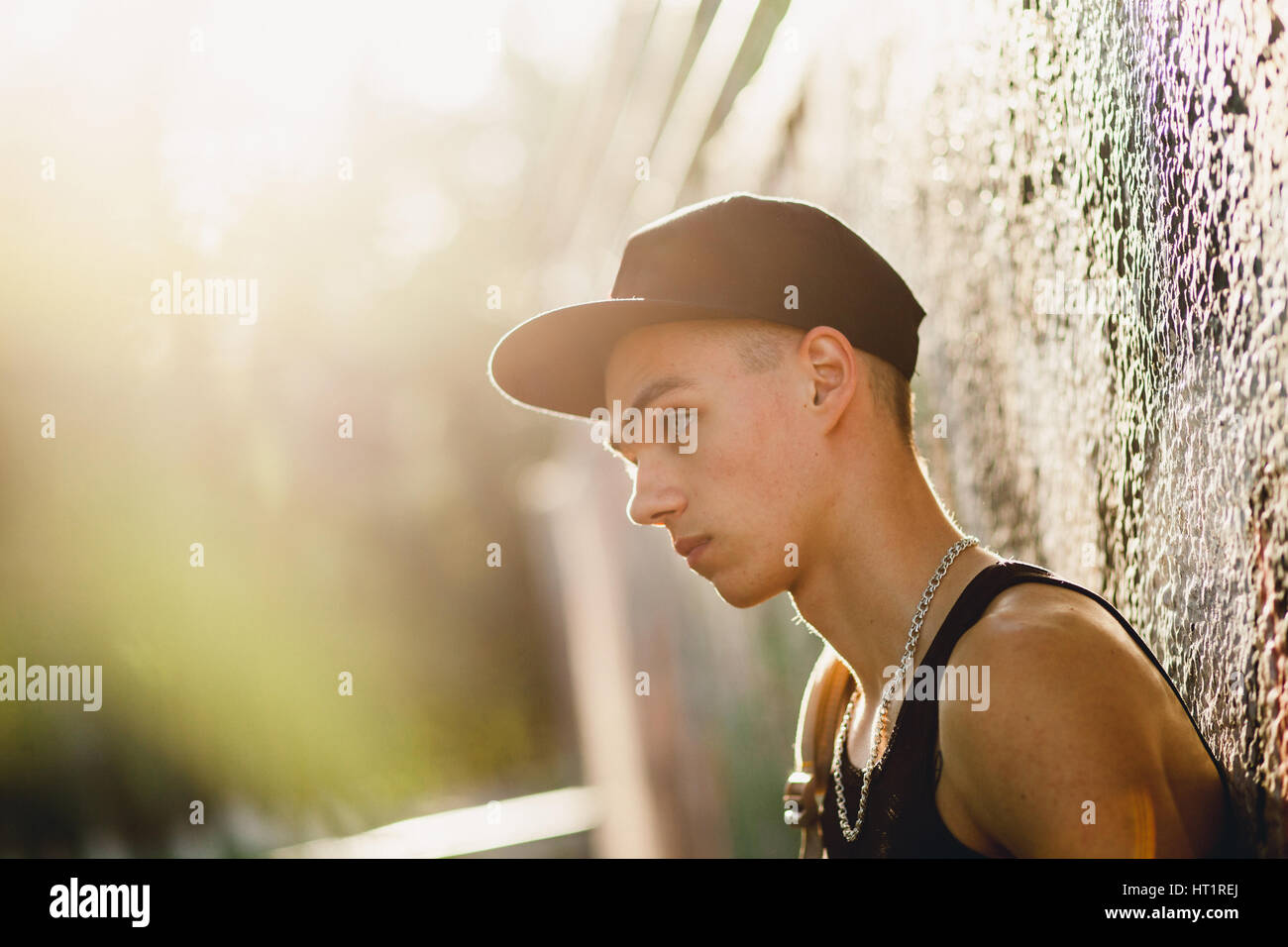 hip hop teenage man. Teenager walk on street in cap. Portrait of ...
