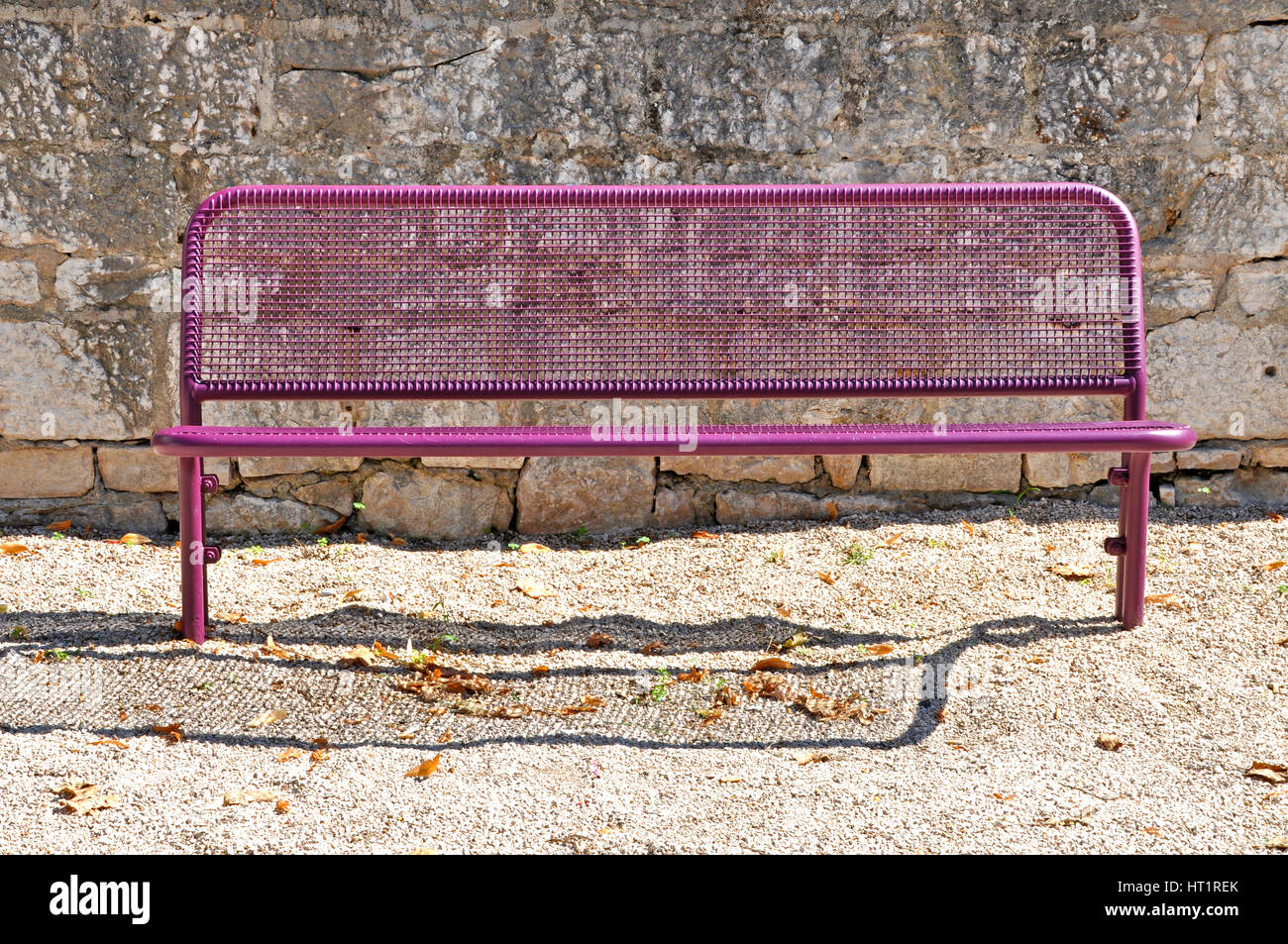 Purple bench on city street Stock Photo - Alamy