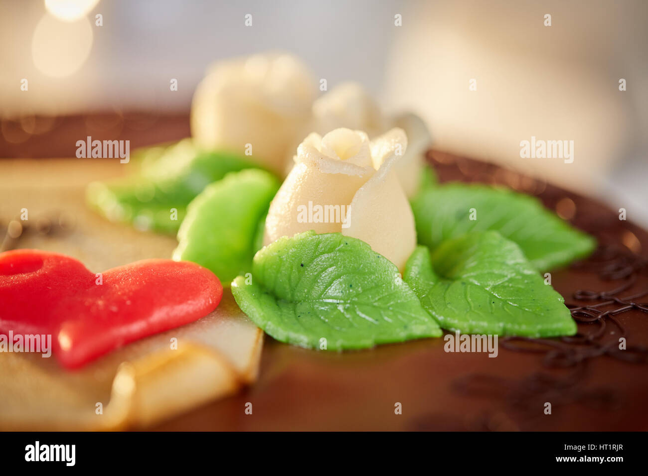 White marzipan roses with green leaves on chocolate cake sacher torte ...