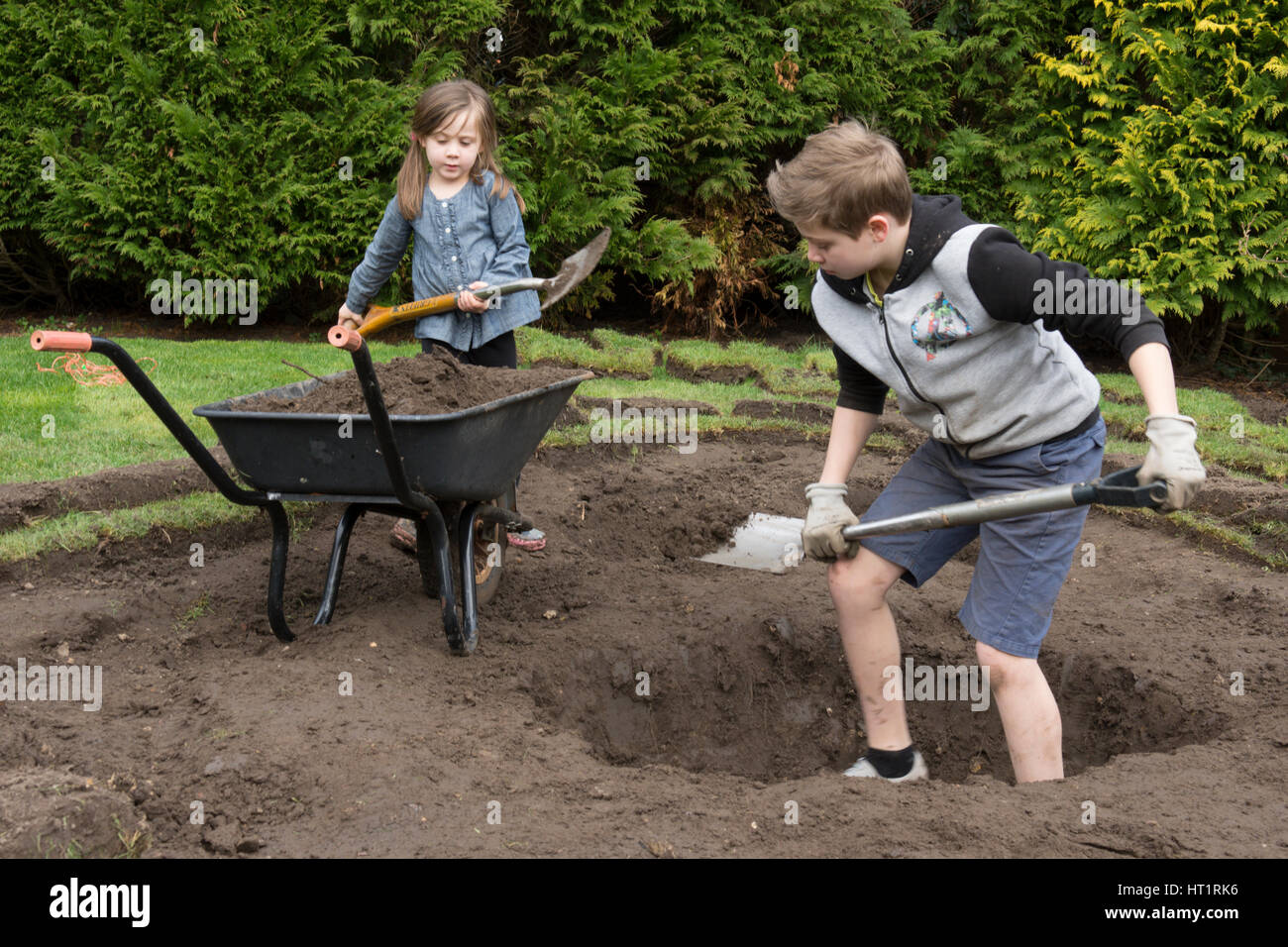 Girl digging hi-res stock photography and images - Alamy