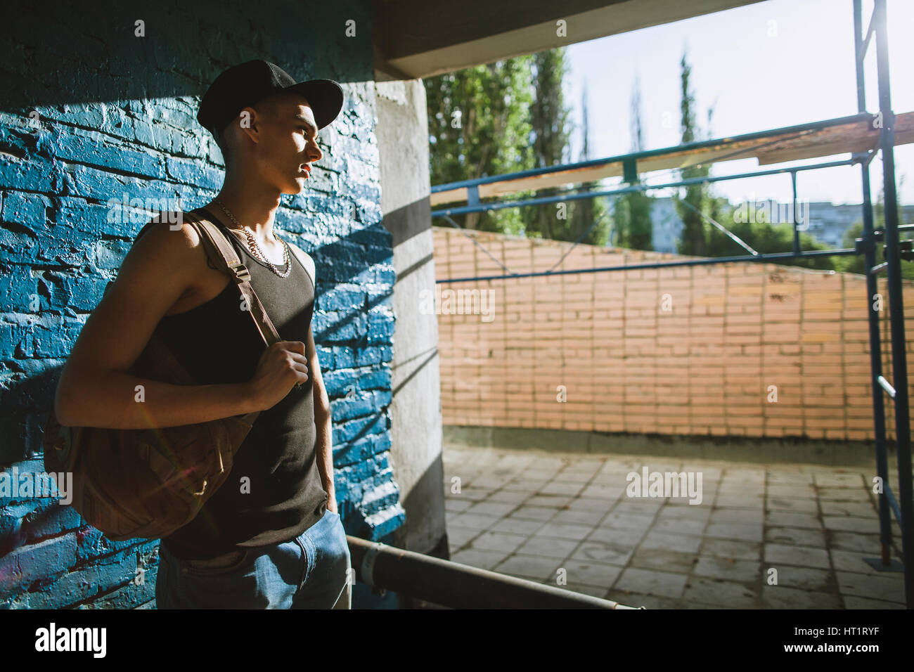 teenager walk with backpack. Hip hop teenager walk on street Stock ...