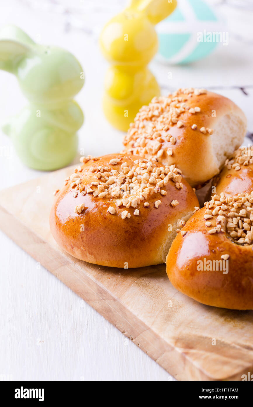 Freshly cooked homemade mini brioche buns on festive Easter table Stock ...