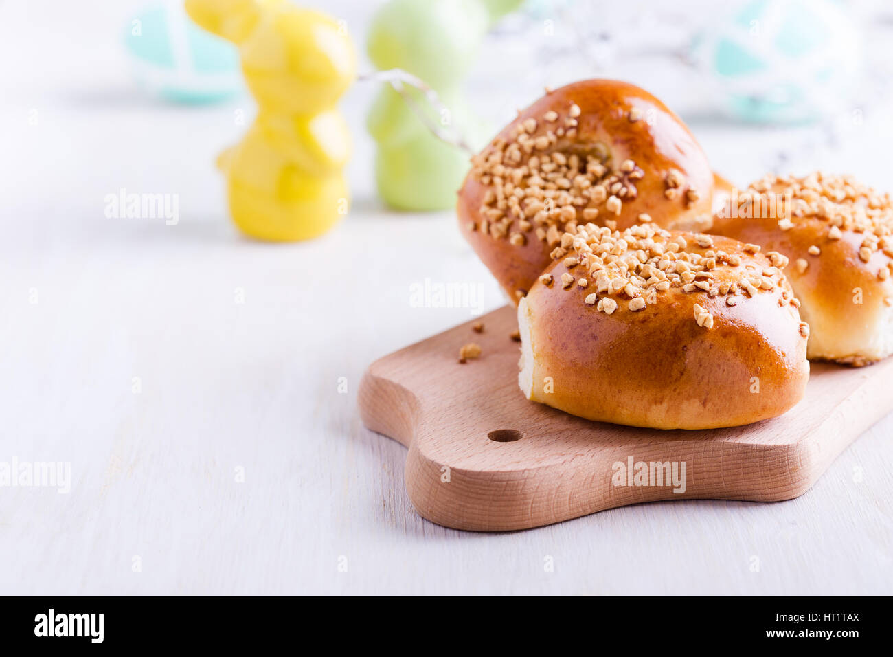 Freshly cooked homemade mini brioche buns on festive Easter table Stock ...