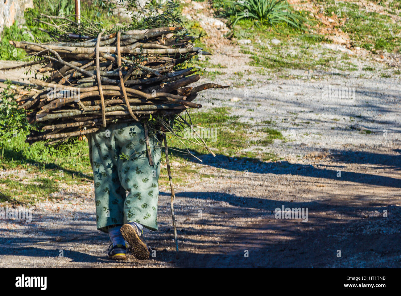 Old woman carrying heavy load hi-res stock photography and images - Alamy