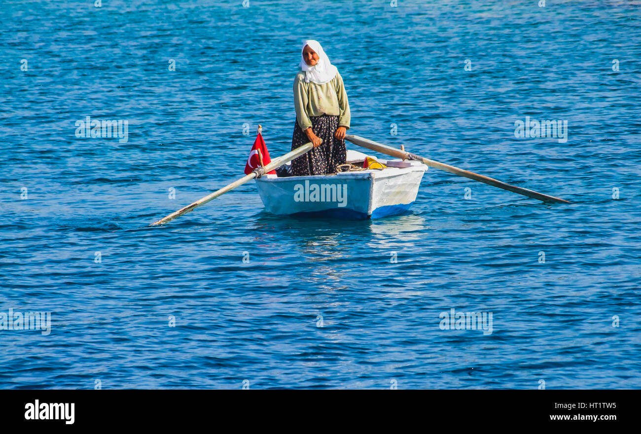 old woman trading on small boat in the sea Stock Photo - Alamy
