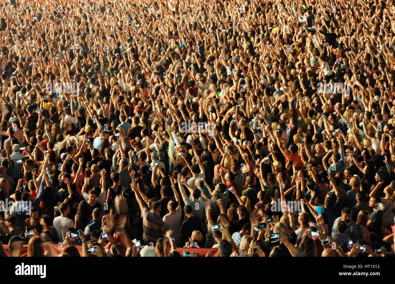 CLUJ NAPOCA, ROMANIA – AUGUST 2, 2015: Crowd of cheerful people having ...