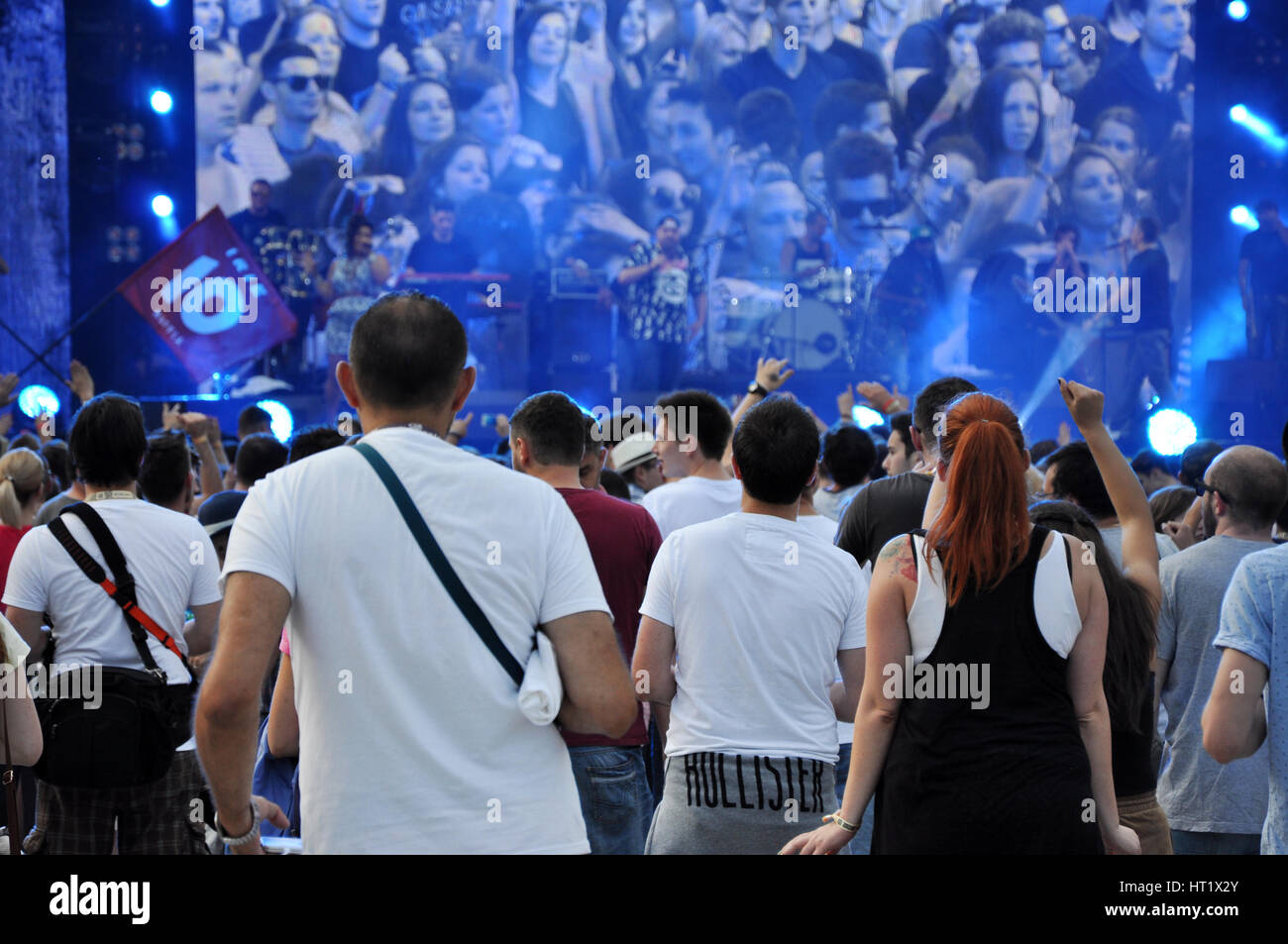 CLUJ NAPOCA, ROMANIA – AUGUST 2, 2015: Crowd of cheerful people having ...