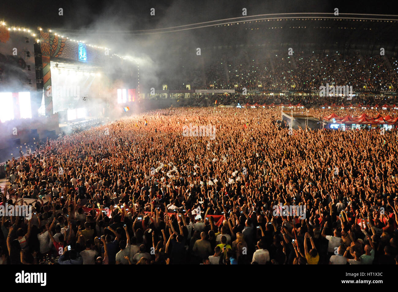 CLUJ NAPOCA, ROMANIA – AUGUST 2, 2015: Crowd of partying people enjoy a ...