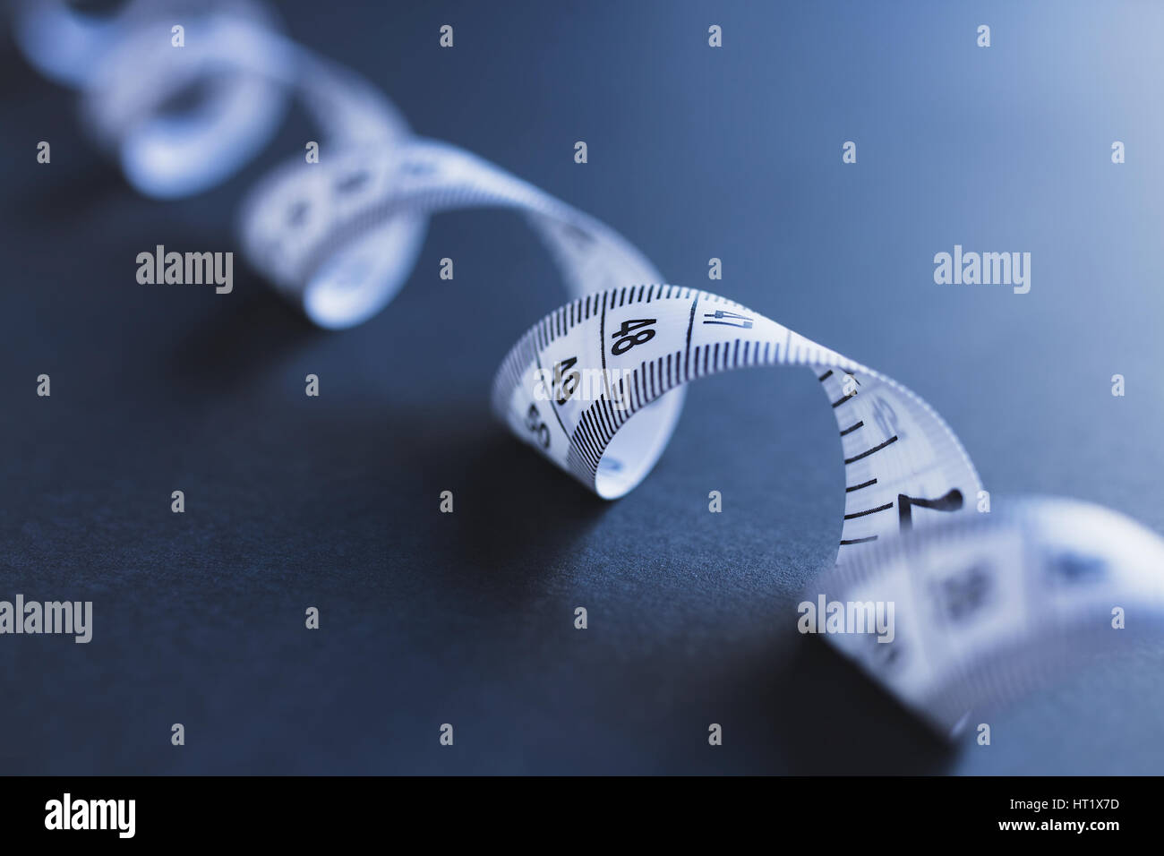 Rolled tape measure hi-res stock photography and images - Alamy