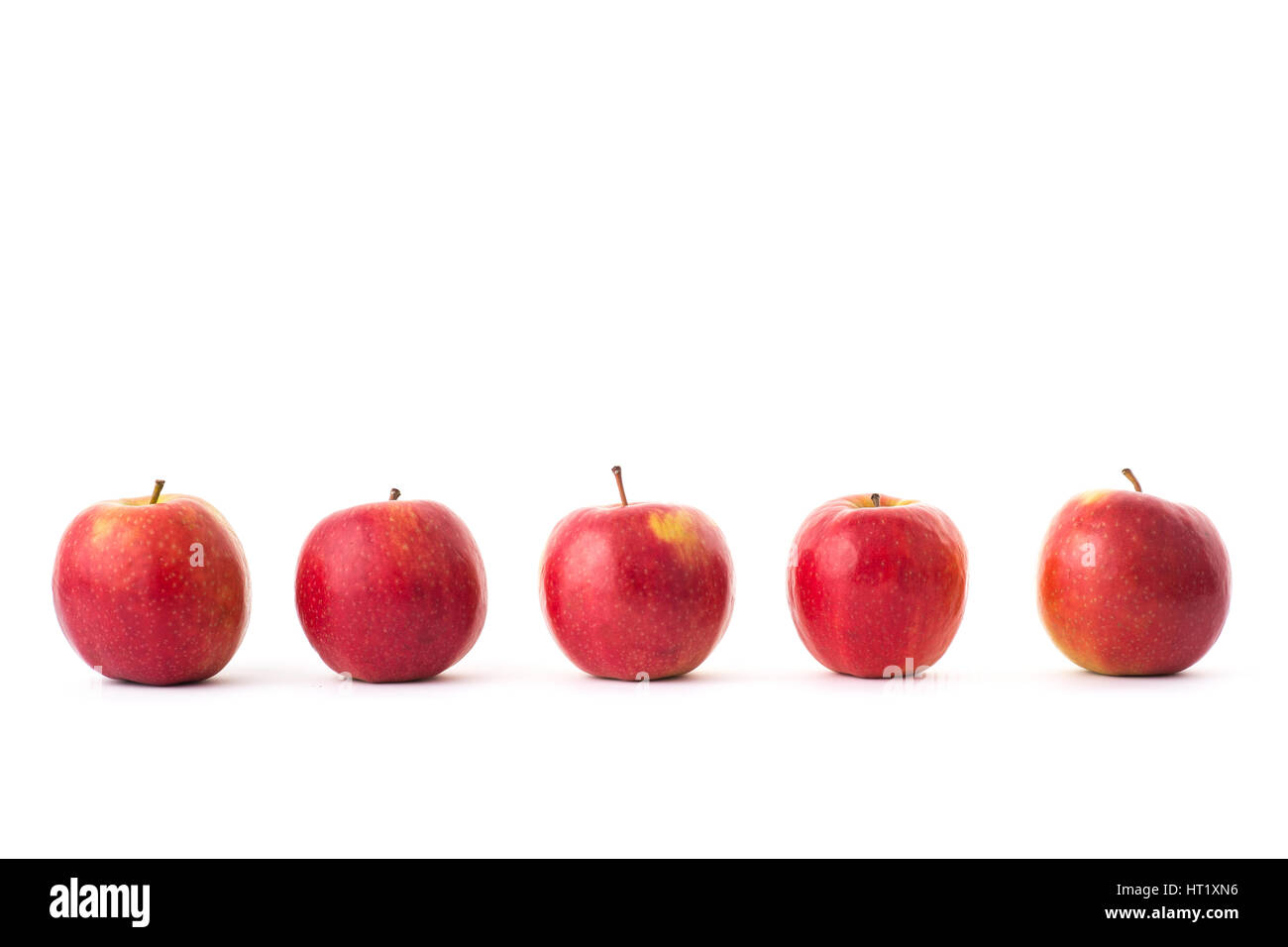 Line of Red Apples. Isolated on a white background Stock Photo - Alamy