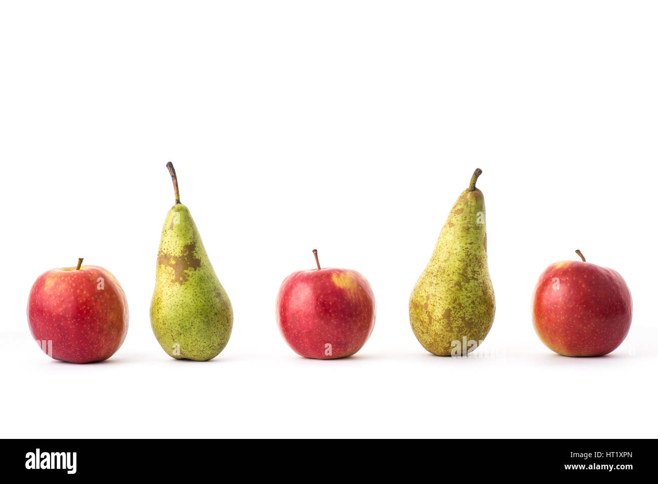 Apples and pears in a line. Isolated on a white background Stock Photo ...