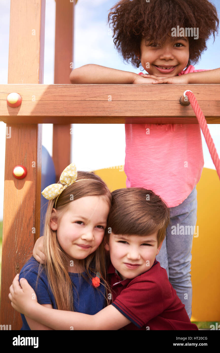 Happy team of little friends at the playground Stock Photo - Alamy