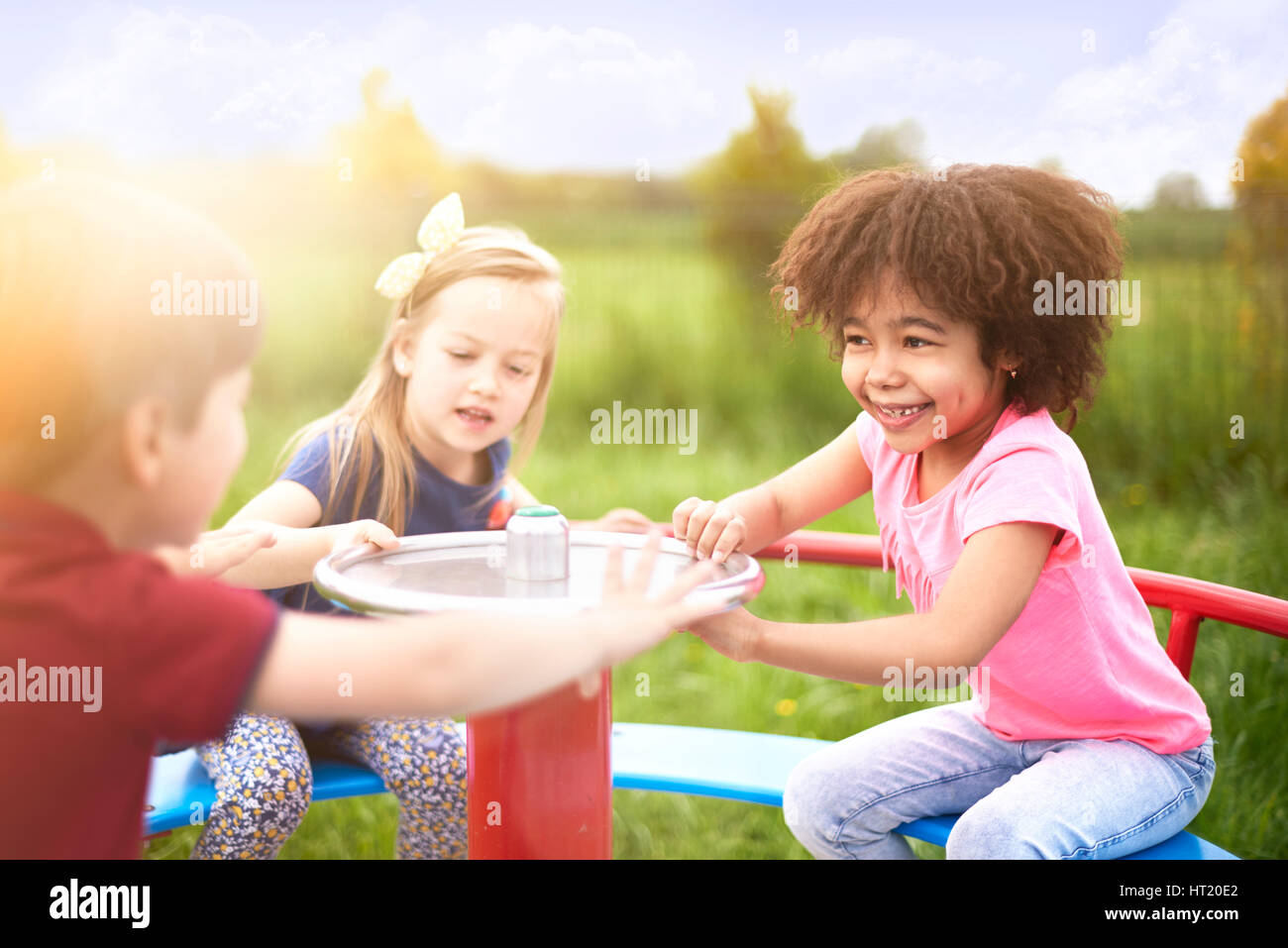 Kids always like to turn quickly on the carousel Stock Photo - Alamy
