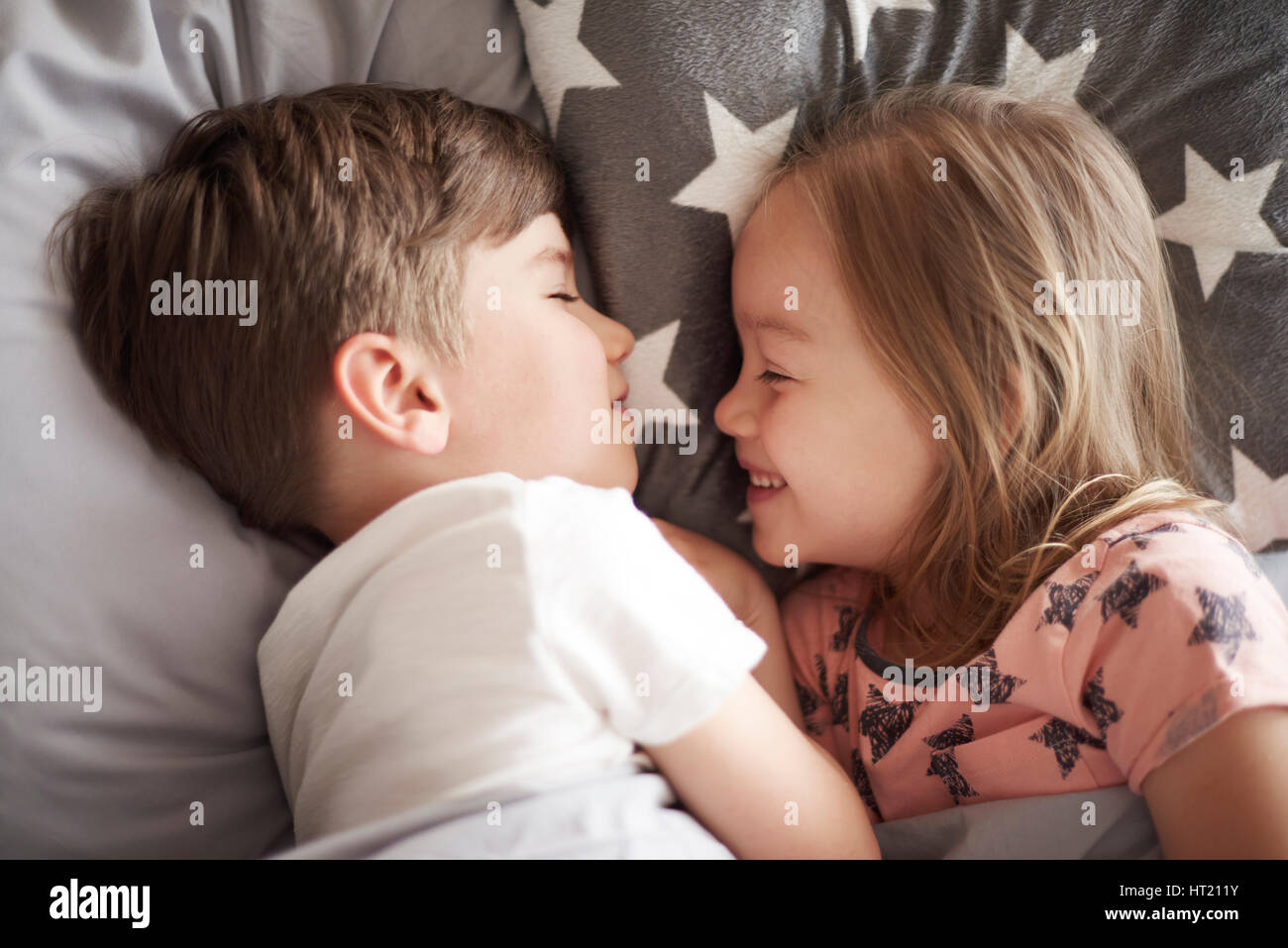 Little children pretending to sleep Stock Photo - Alamy