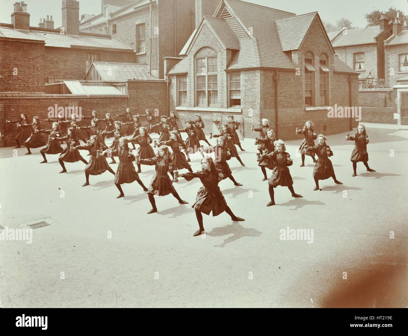 Girls doing drill in the playground, Wilton Road School, London, 1907 ...